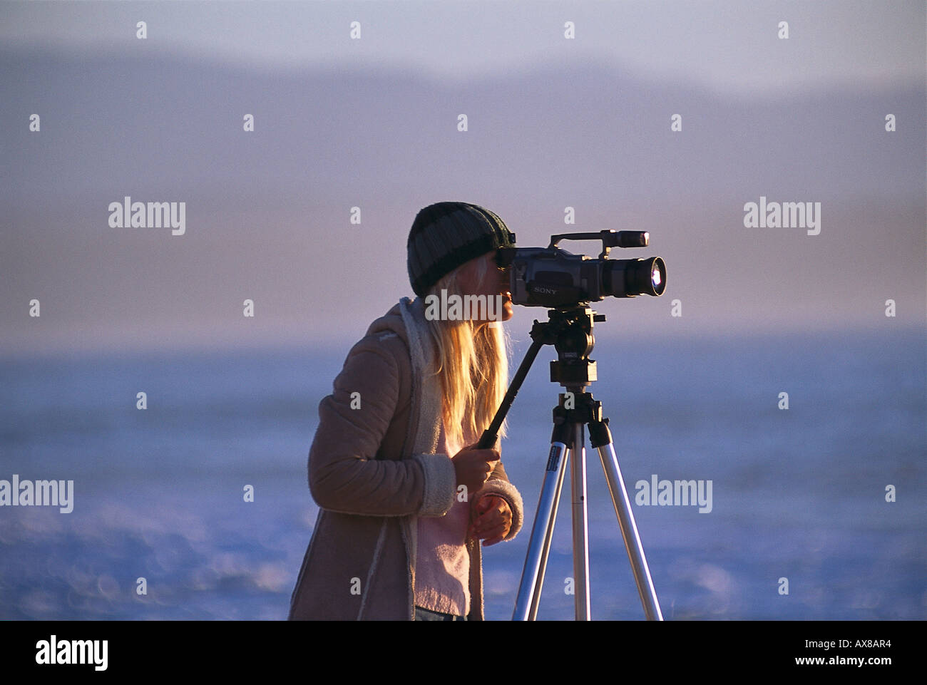 Woman with video camera, Filming, South Africa Stock Photo - Alamy
