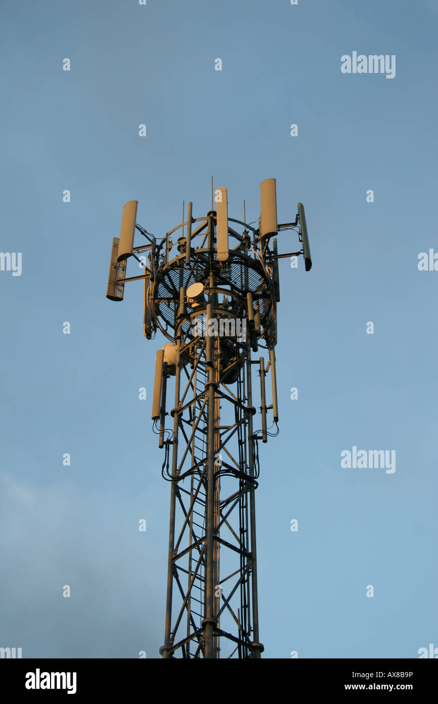 Mobile phone communication mast against blue sky Stock Photo - Alamy