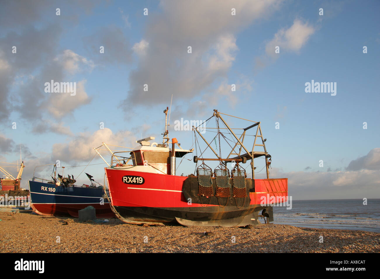 Red fishing boat side view Stock Photo - Alamy