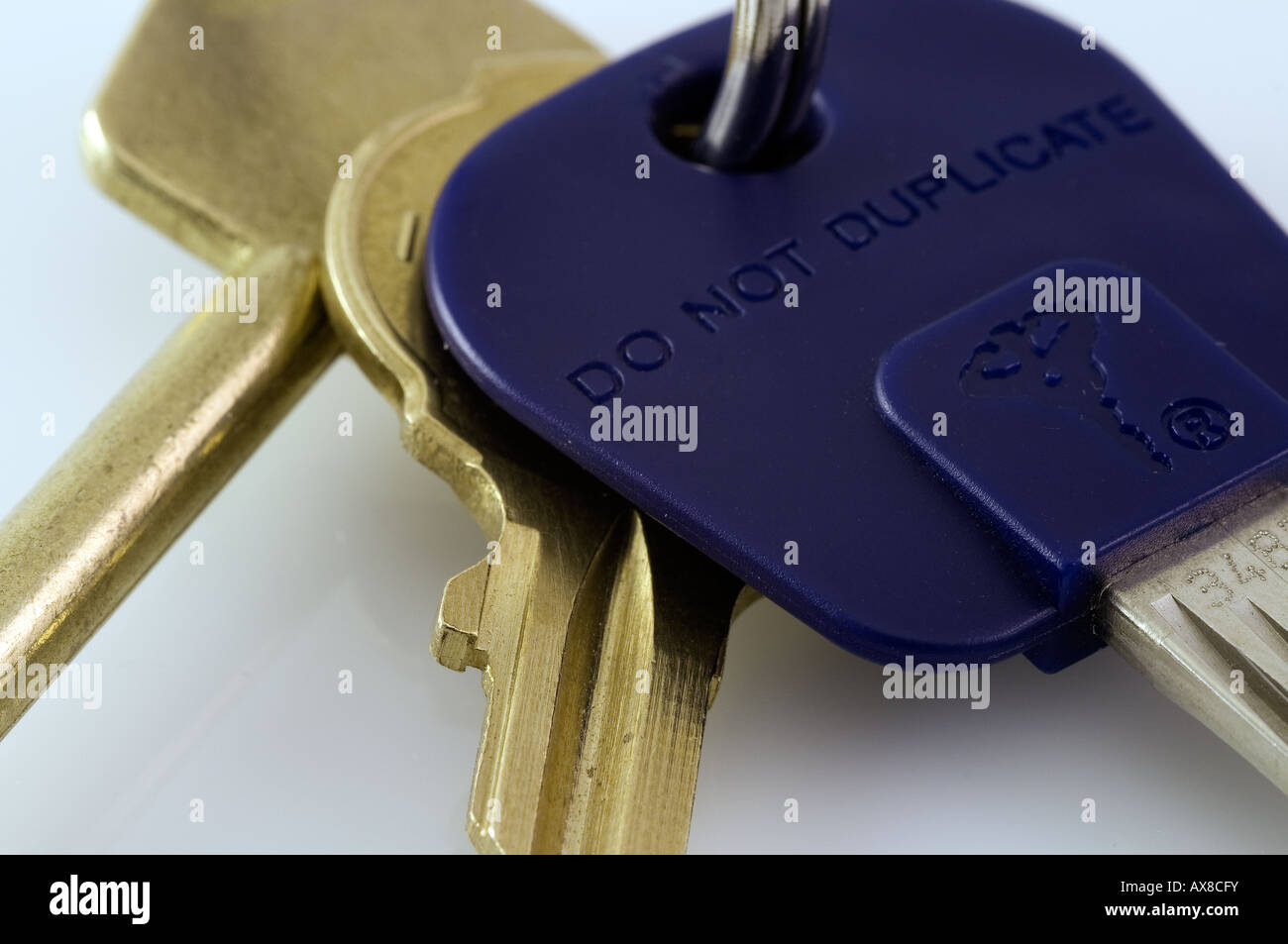 Close up of a bunch of 3 keys on a ring Stock Photo - Alamy