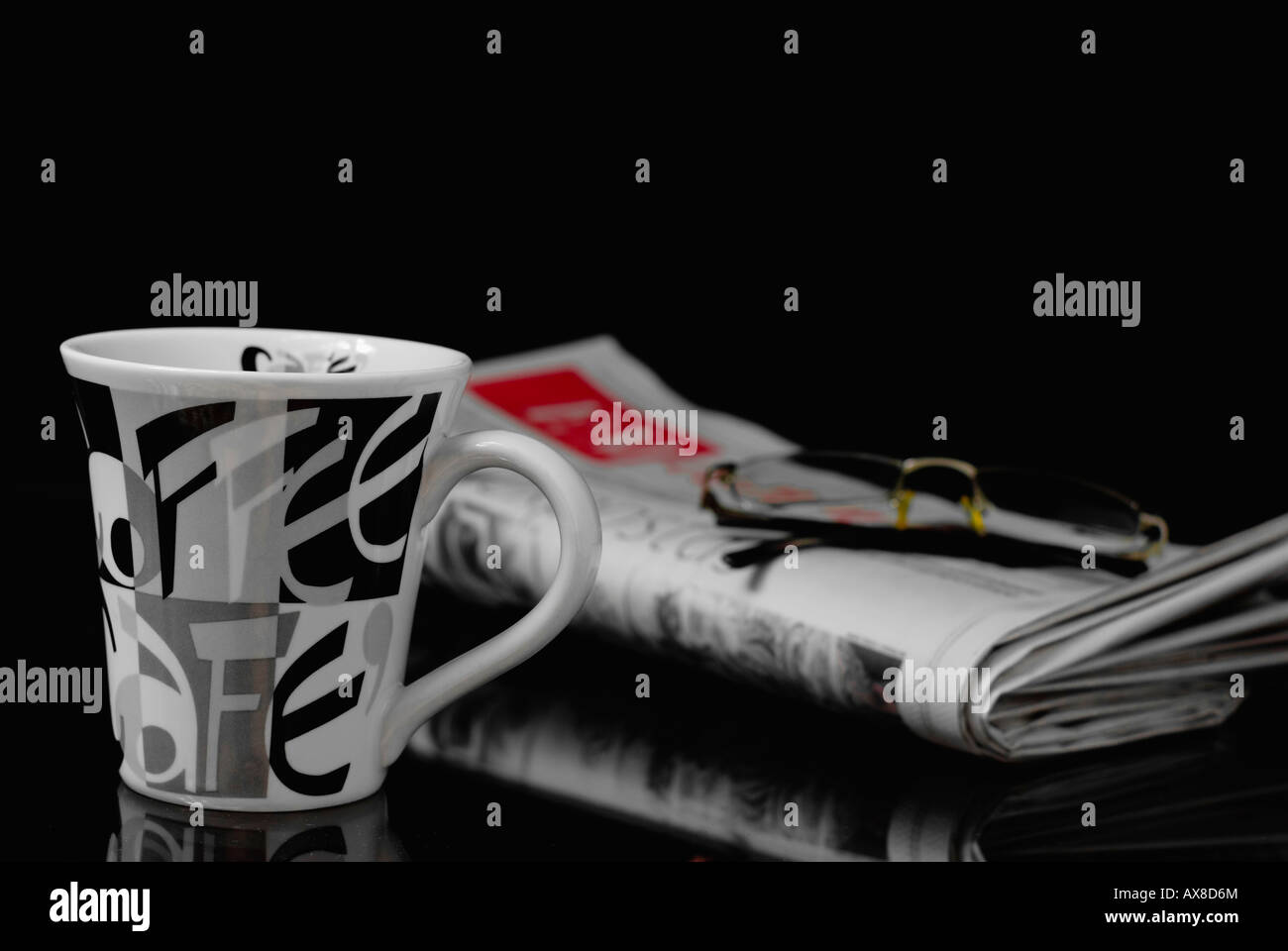Coffee mug and newspaper Stock Photo - Alamy