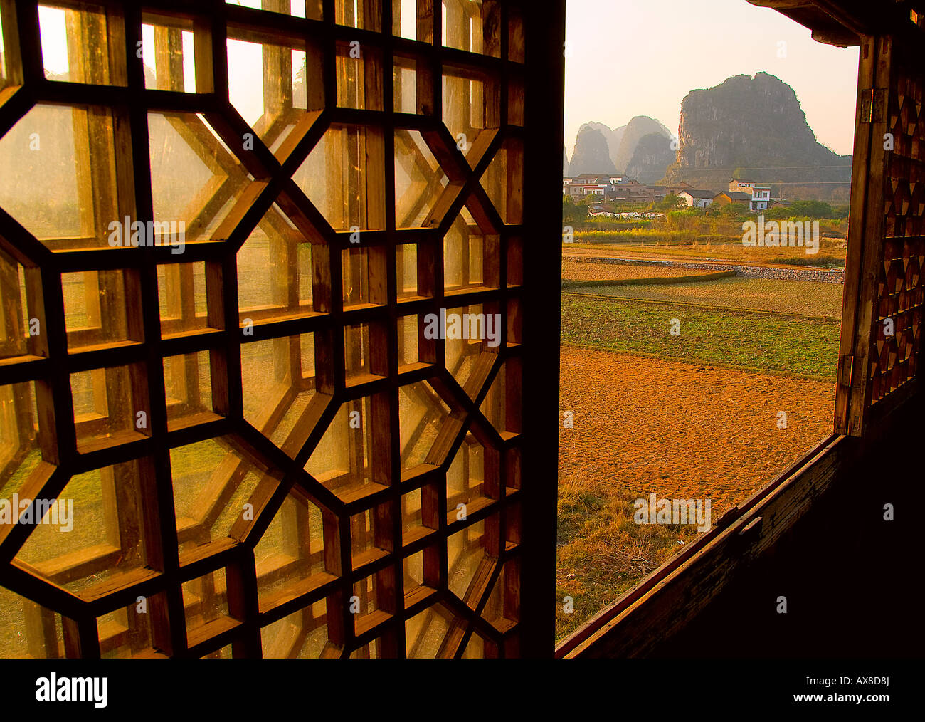 A view through a a traditional Chinese screen window across the ...