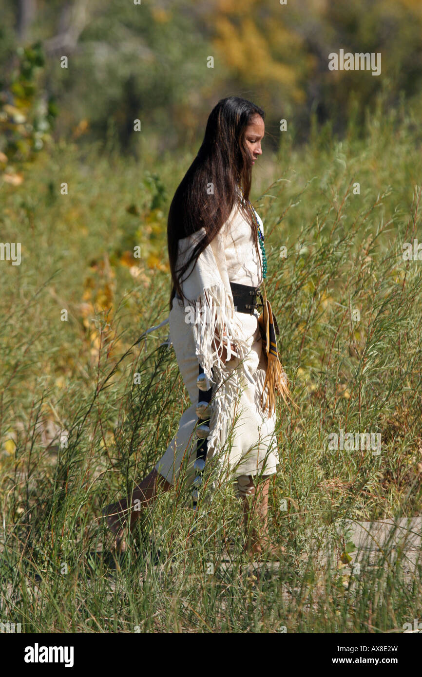 A Native American Indian women walking along the riverbank in South ...