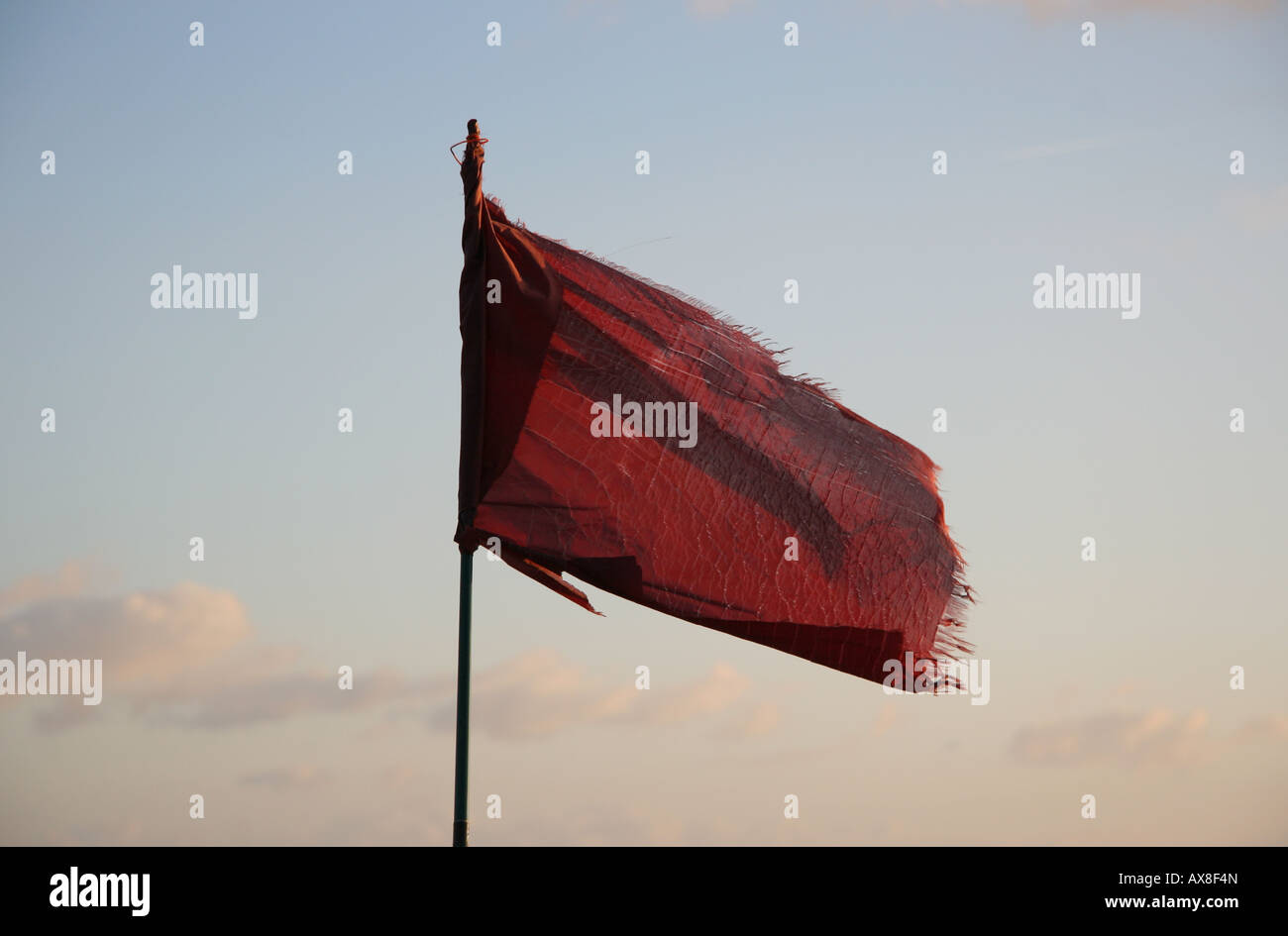 Torn red flag hi-res stock photography and images - Alamy