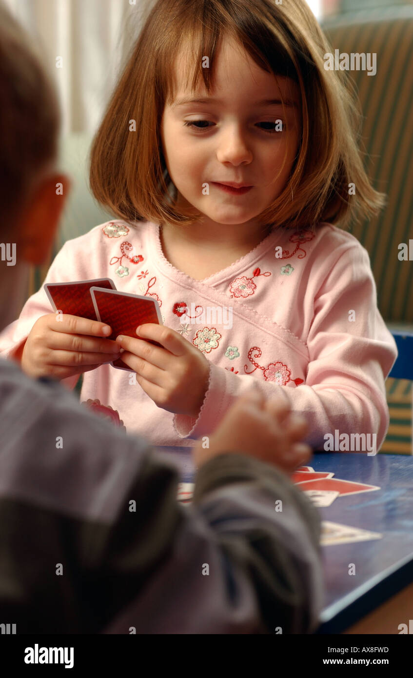 Young children playing cards Stock Photo - Alamy