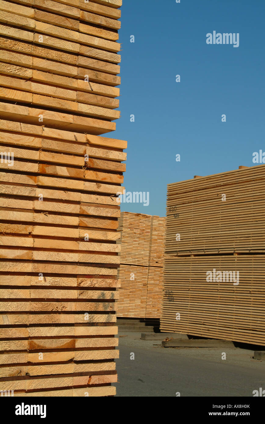 stacks of lumber and blue sky Stock Photo - Alamy