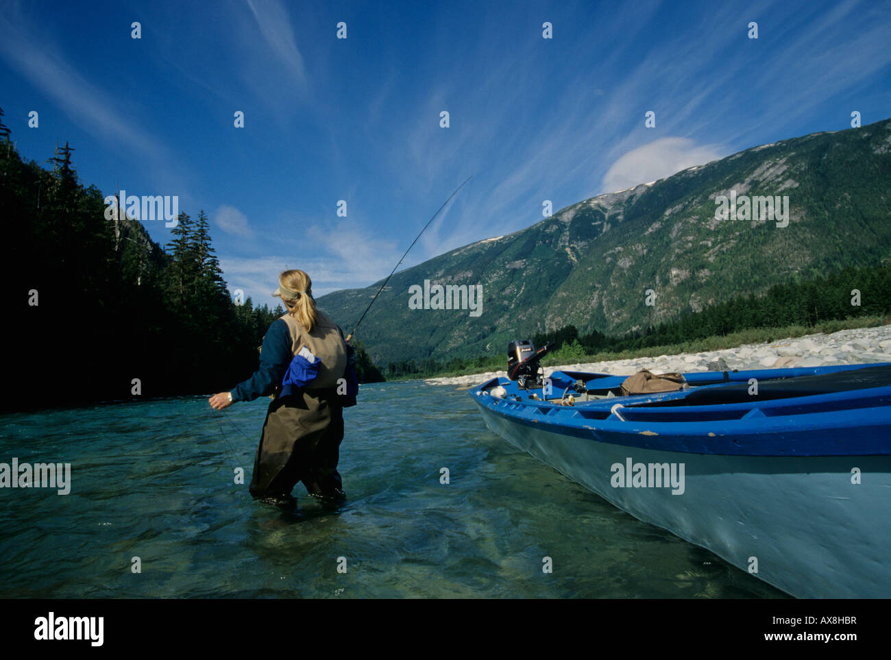 Lady flyfisher fishing for steelhead Dean river British Columbia Stock ...