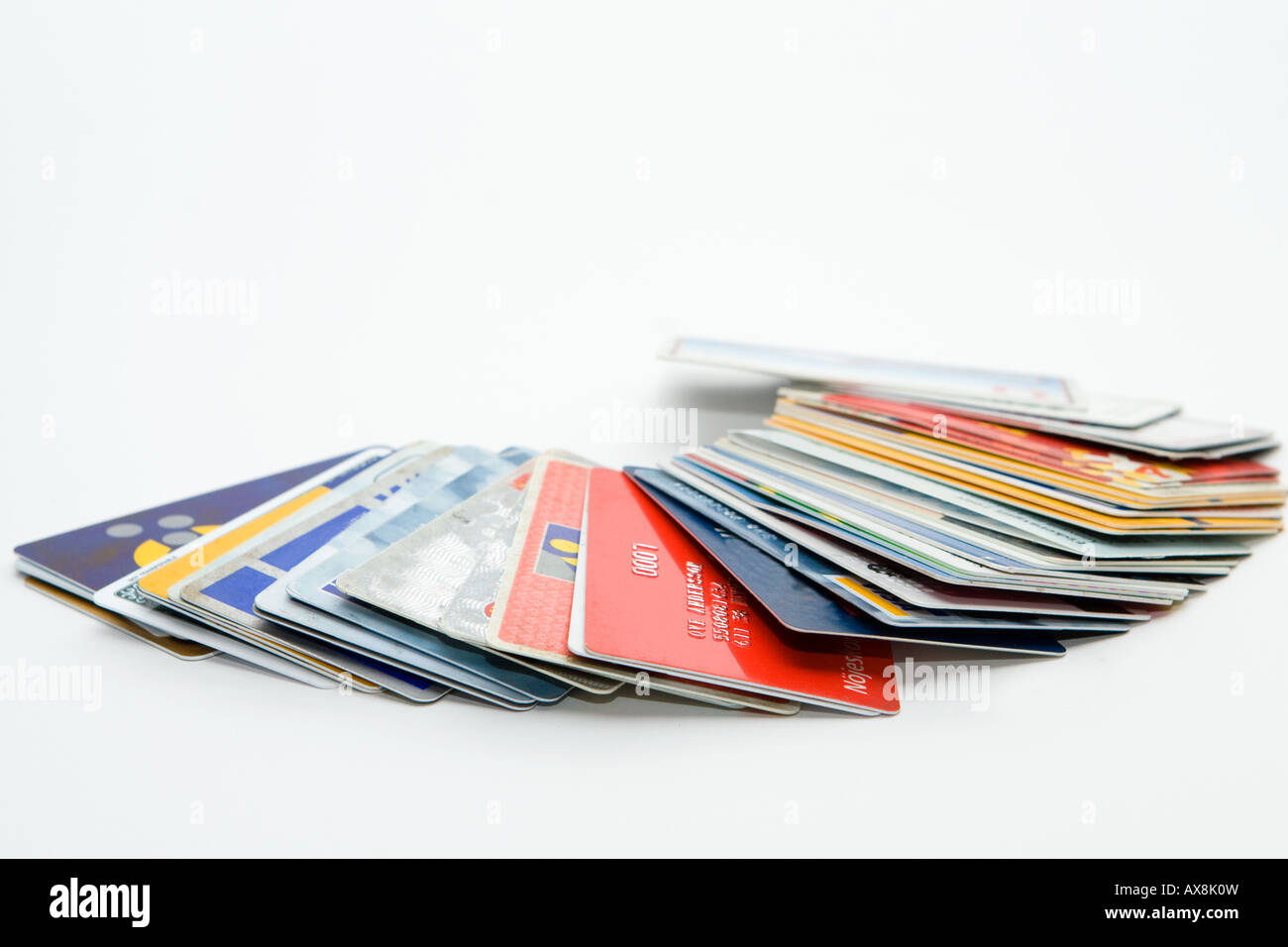 Credit card widespread on a white table Stock Photo - Alamy
