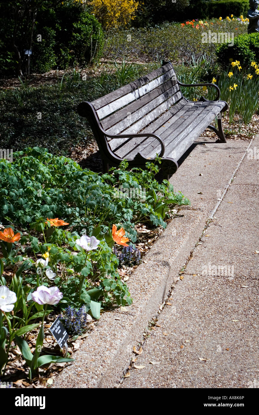 Empty Park Bench Among Flowers Stock Photo - Alamy