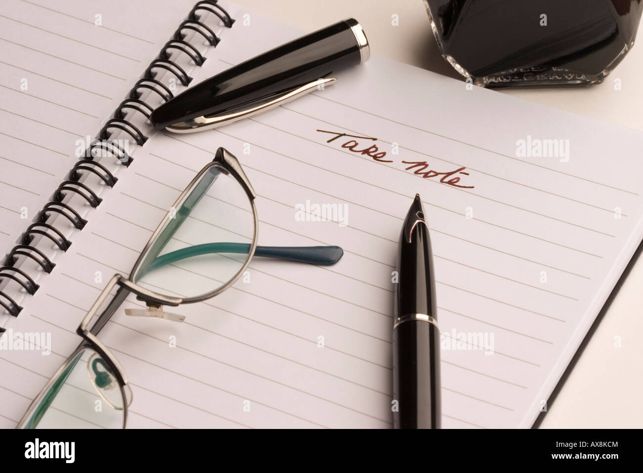 Writing on a page of a note book using a fountain pen Stock Photo - Alamy