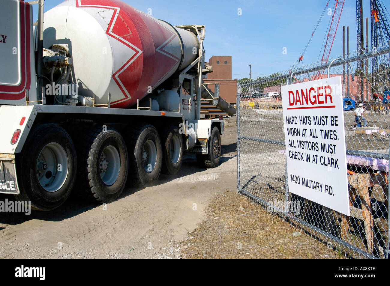 Large cement mixing truck enters construction area Stock Photo - Alamy