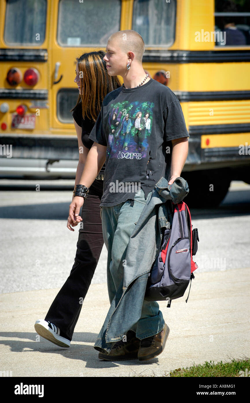 High school students leave at the end of the day to ride school busses ...