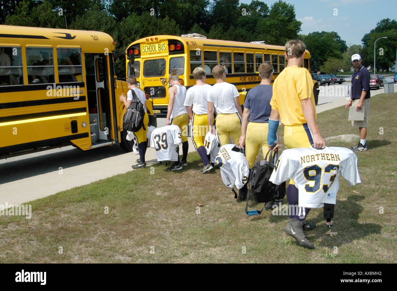 High school students leave at the end of the day to ride school busses ...