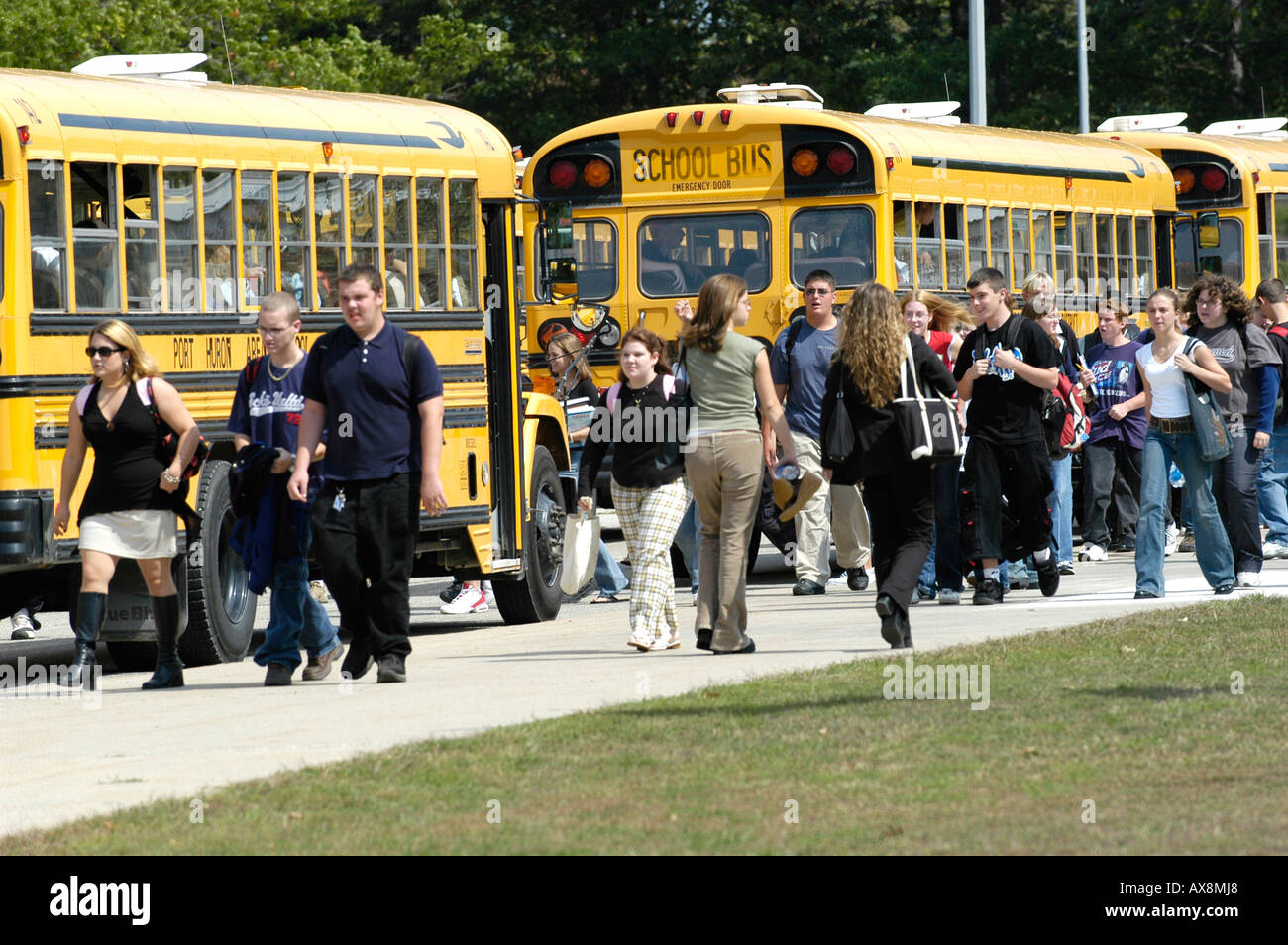 High school students leave at the end of the day to ride school busses ...
