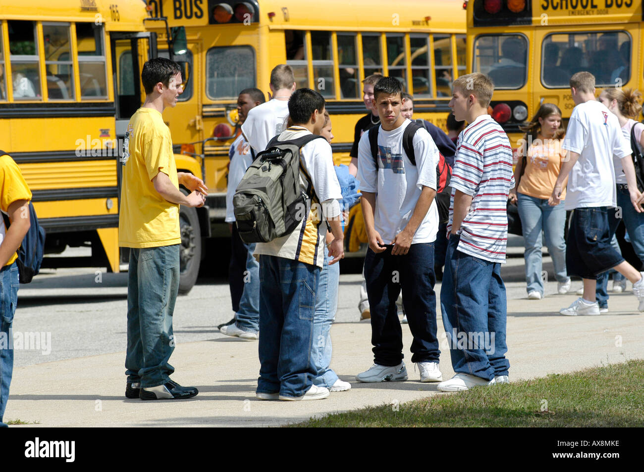 High school students leave at the end of the day to ride school busses ...