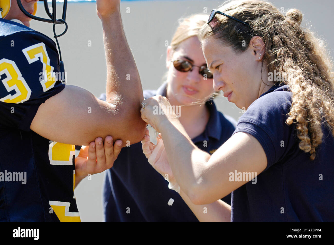 American High School Football Action sustaining injury Stock Photo - Alamy