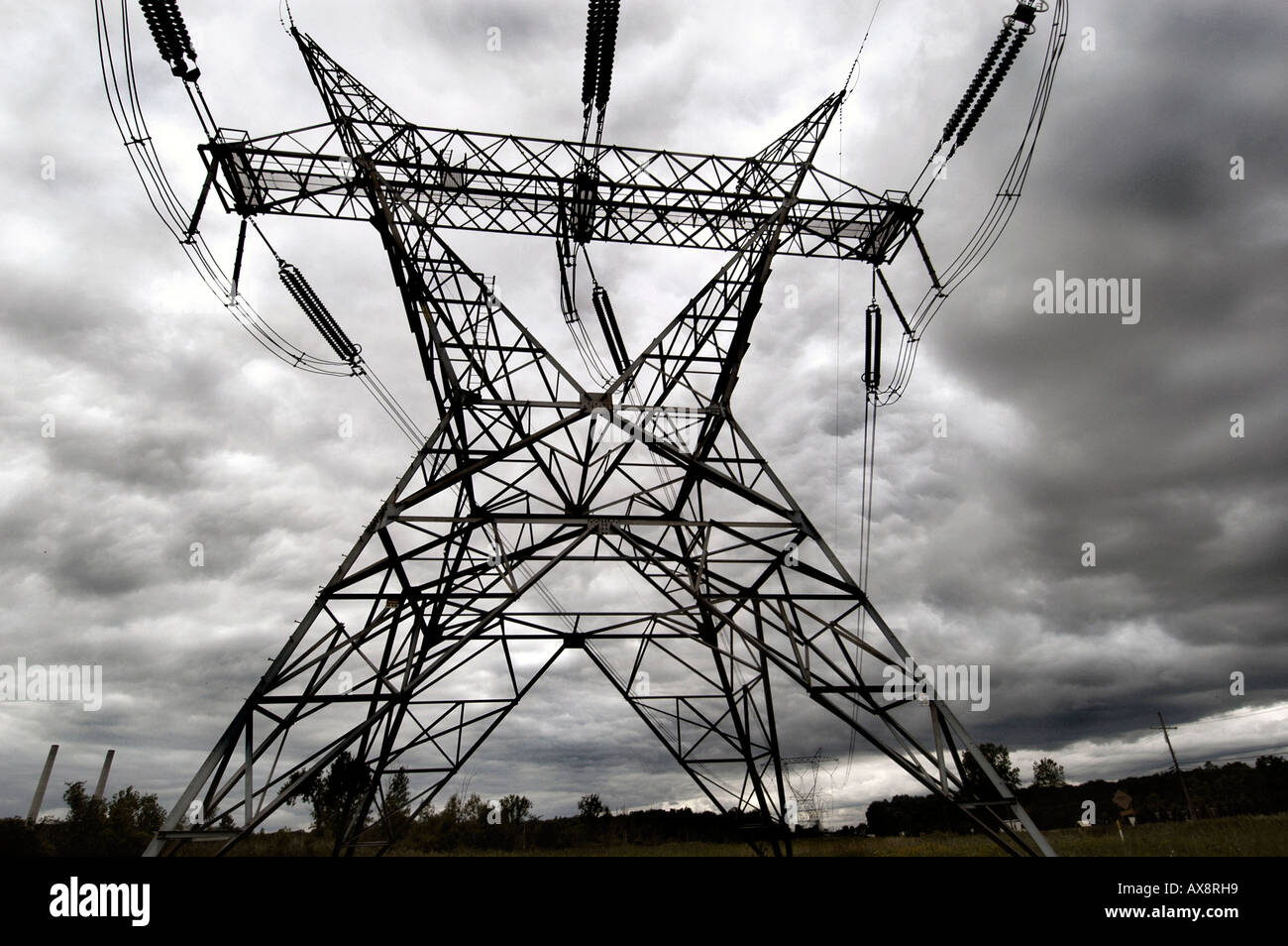 Electrical Power lines with a backdrop of storm clouds Stock Photo - Alamy