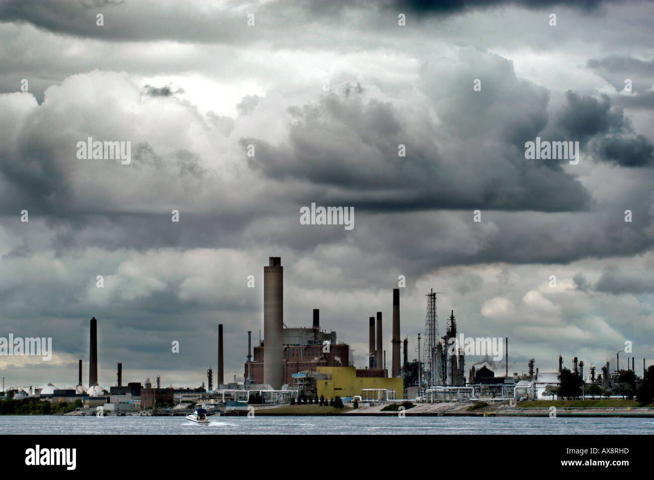 Large industrial complex under storm clouds Stock Photo - Alamy