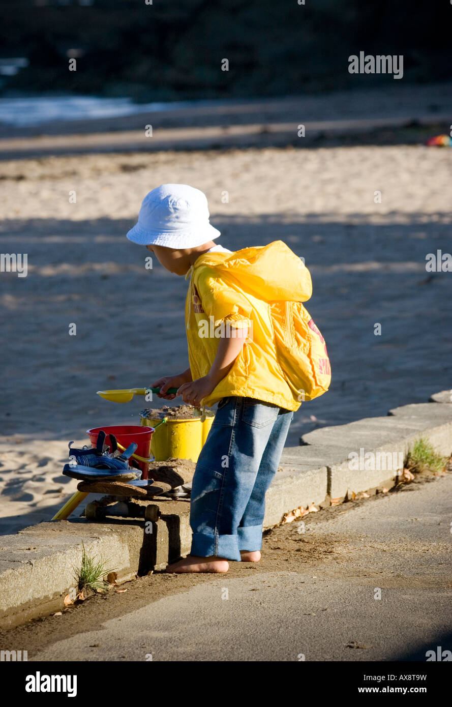 Child with bucket and spade hi-res stock photography and images - Alamy
