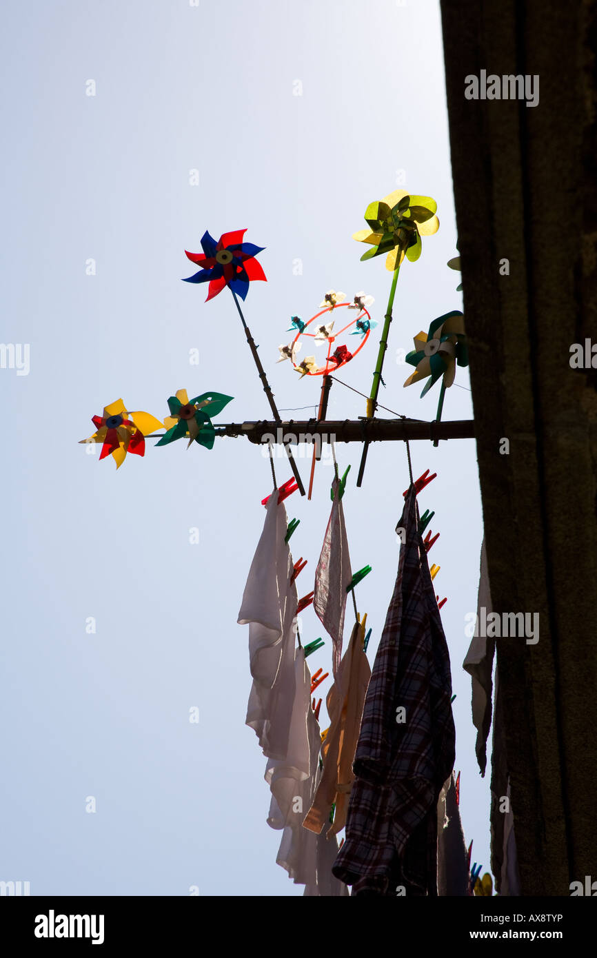 Washing line and toy windmills in Porto Portugal Stock Photo - Alamy