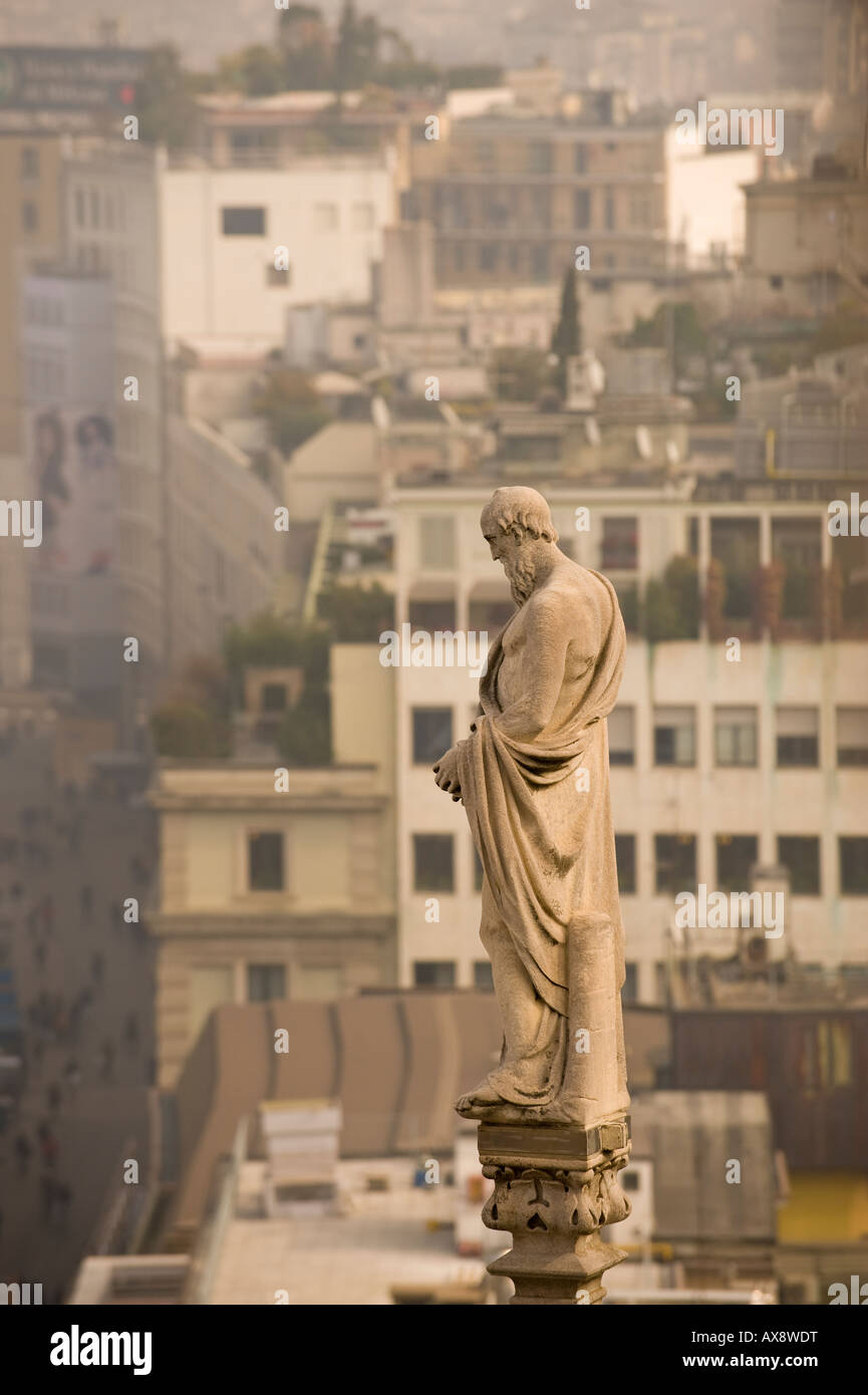 GOTHIC STATUE OF THE DUOMO STANDS OVER MILAN ITALY Stock Photo - Alamy