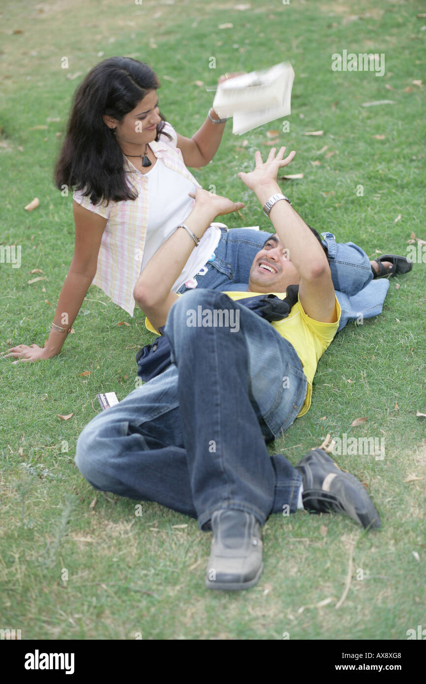 Indian college couple park book hi-res stock photography and images - Alamy