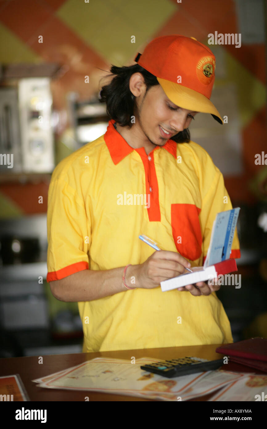 Waiter preparing a bill in a restaurant Stock Photo - Alamy