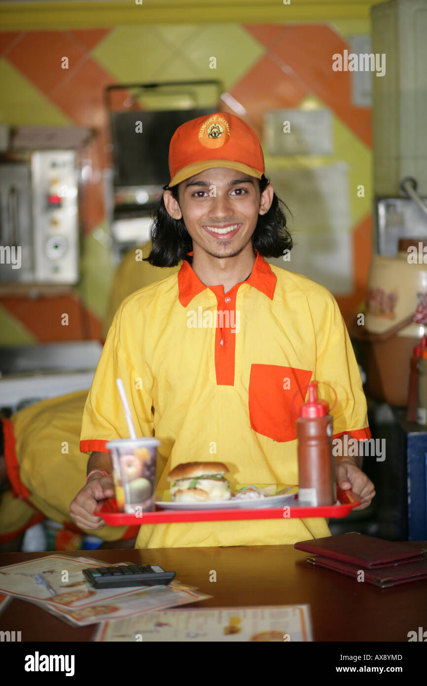 Portrait of a waiter serving food in a restaurant Stock Photo - Alamy