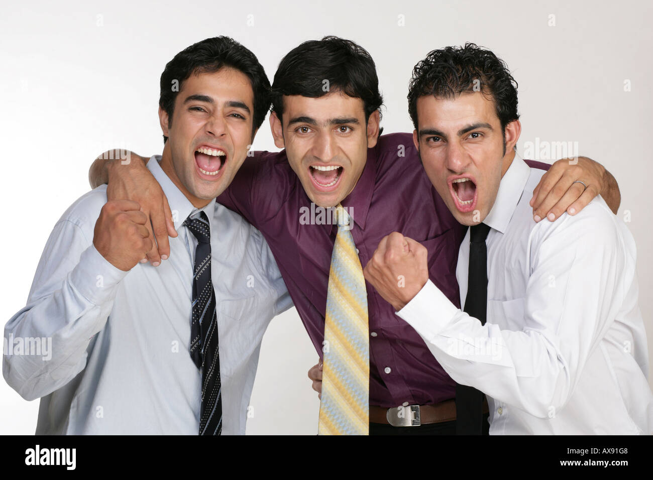 Portrait of three Businessmen cheering Stock Photo - Alamy