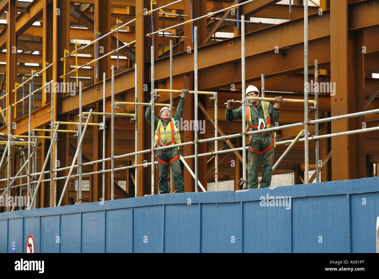 Construction workers assemble scaffolding at St Davids Centre in ...