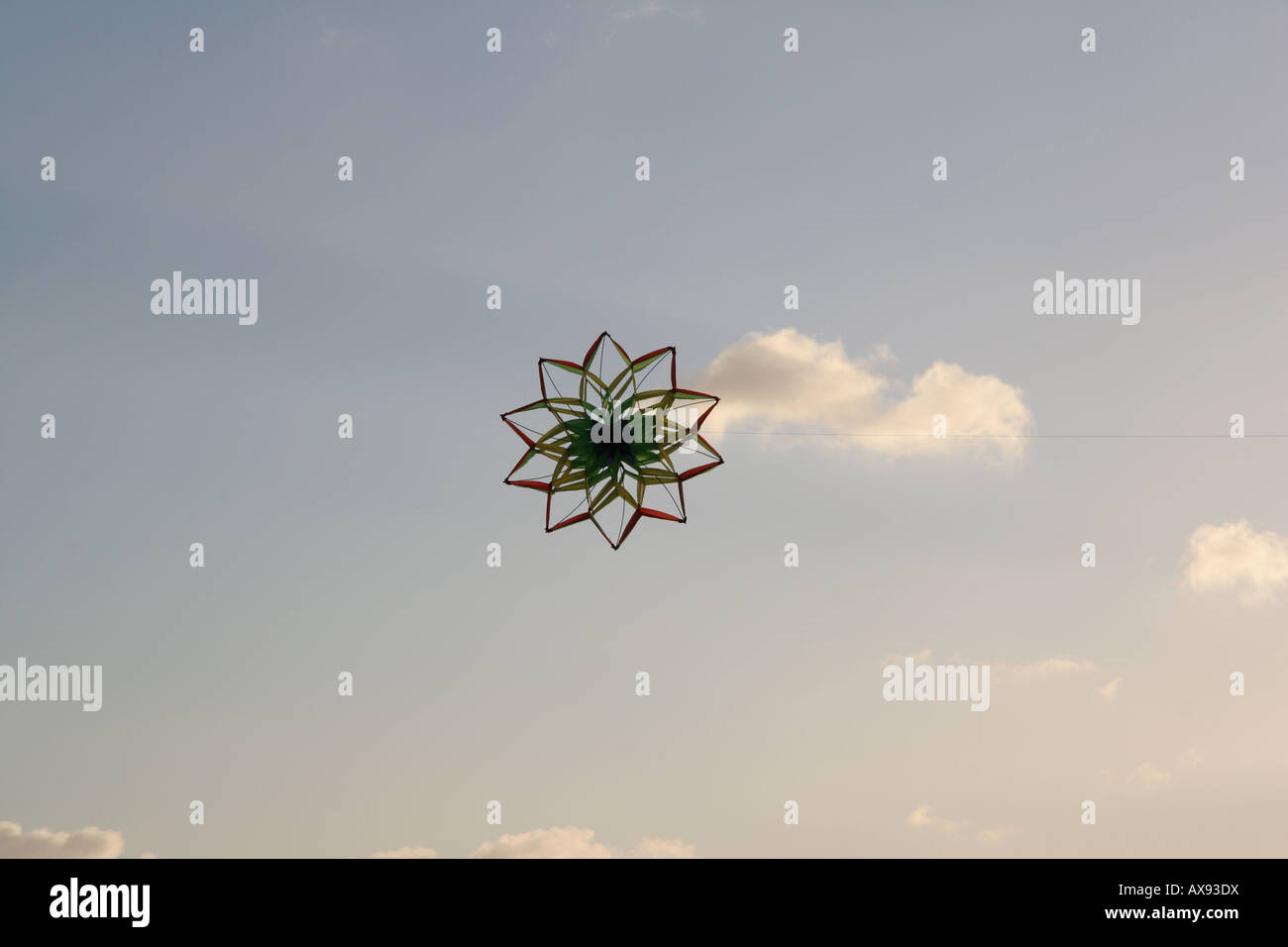 Star shaped kite against blue sky Stock Photo - Alamy