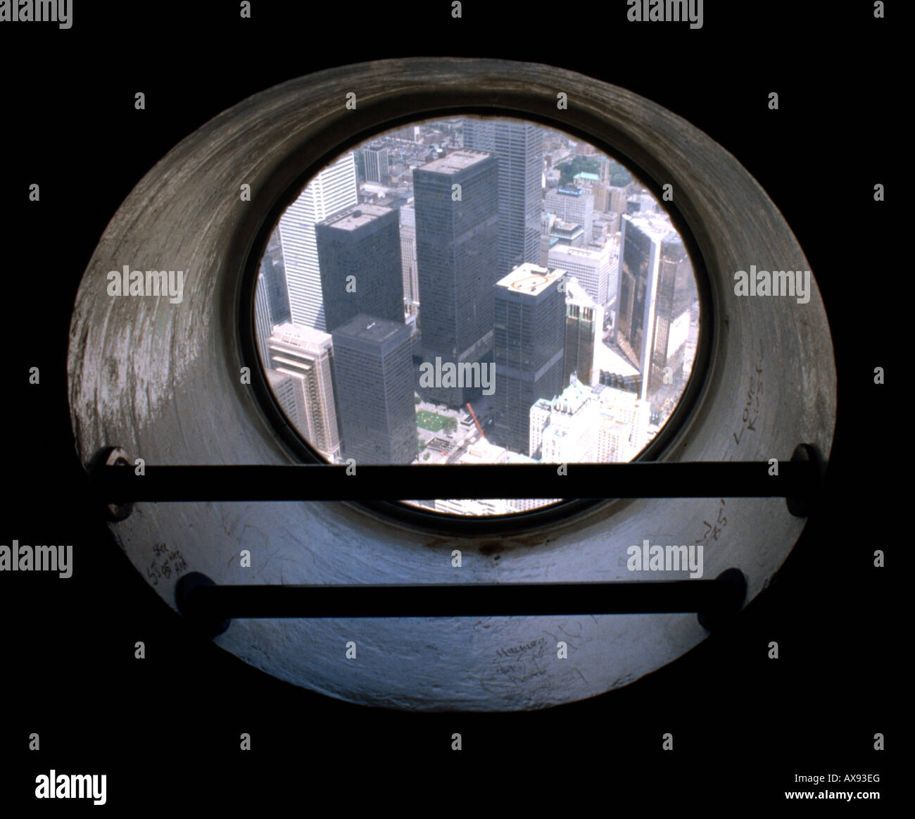 Skyscrapers seen through porthole window in tower in US city Stock ...