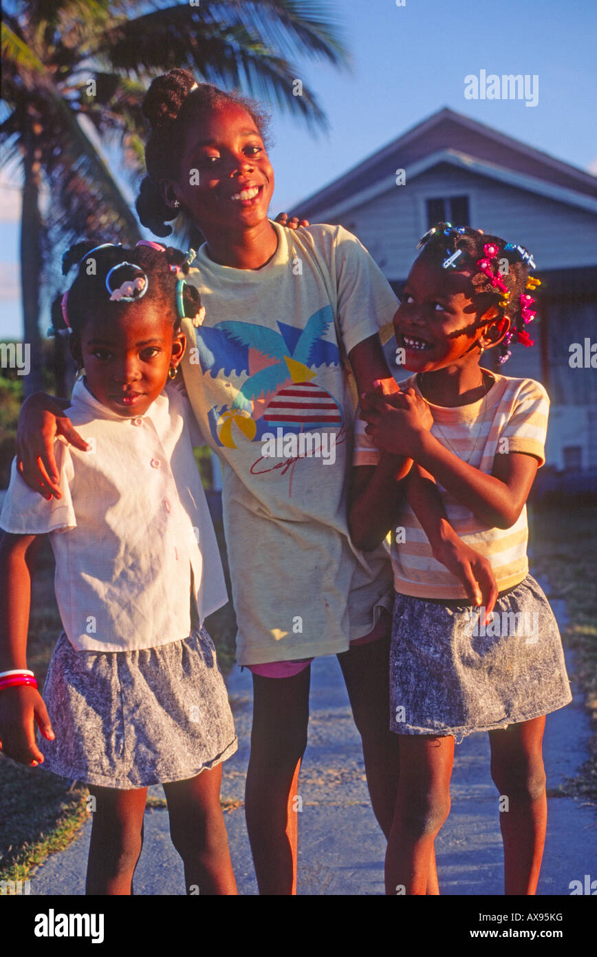 Three young Jamaican girls wearing hair curlers Cayman Brac, Cayman ...