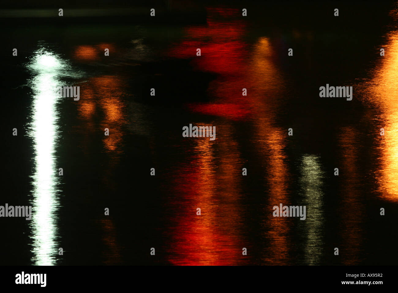 Lights Reflection in water at night Stock Photo - Alamy