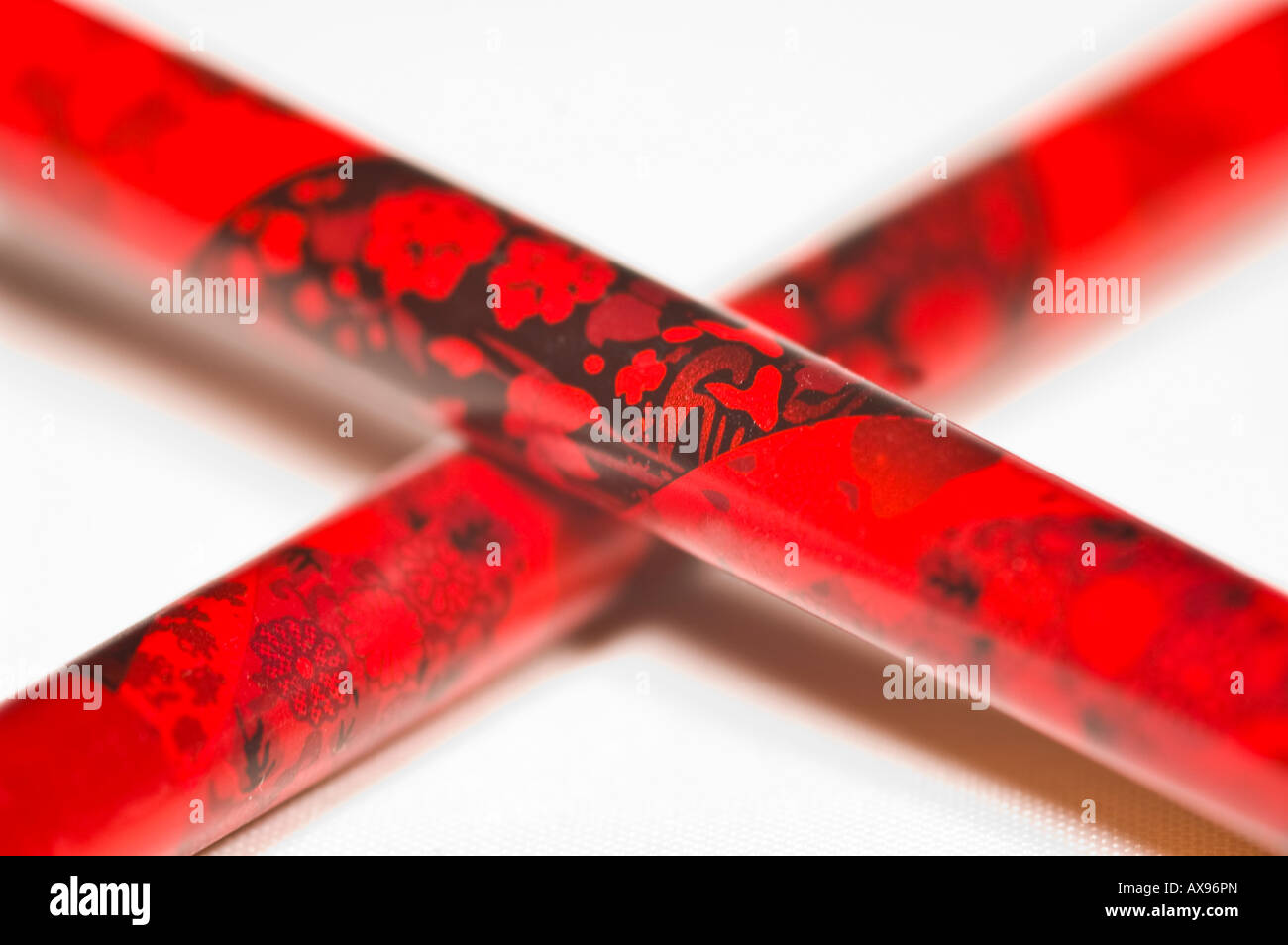 Two red chopsticks arranged in a cross, looking like a flag (high key ...