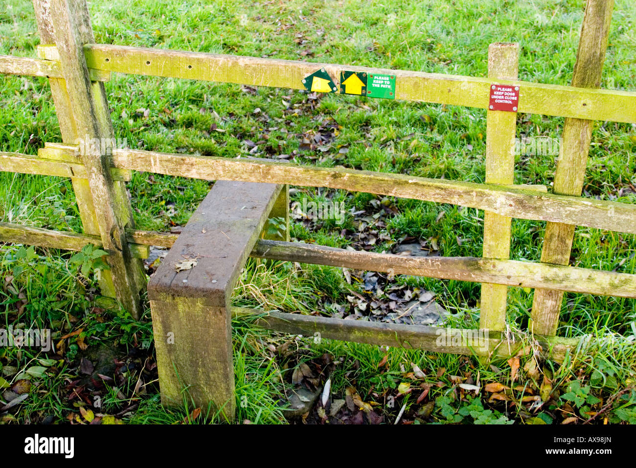 A public footpath stile with a path crossing a field Stock Photo - Alamy