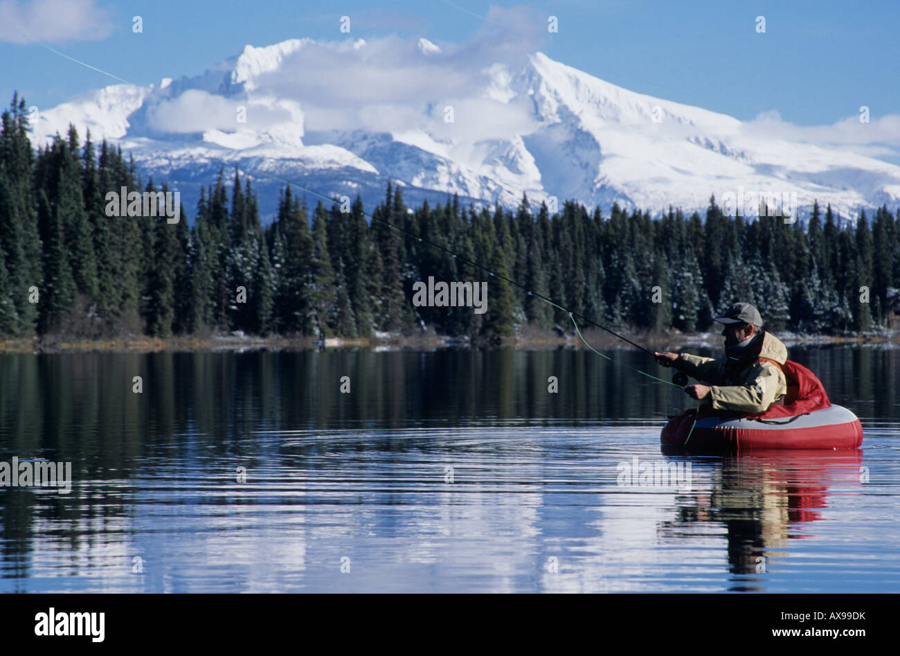 Flyfishing from float tube British Columbia Stock Photo - Alamy