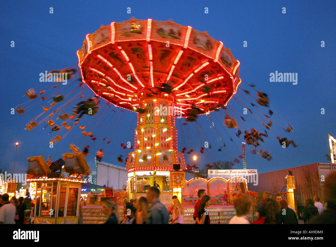 An illuminated chairoplane in an amusement park Stock Photo - Alamy