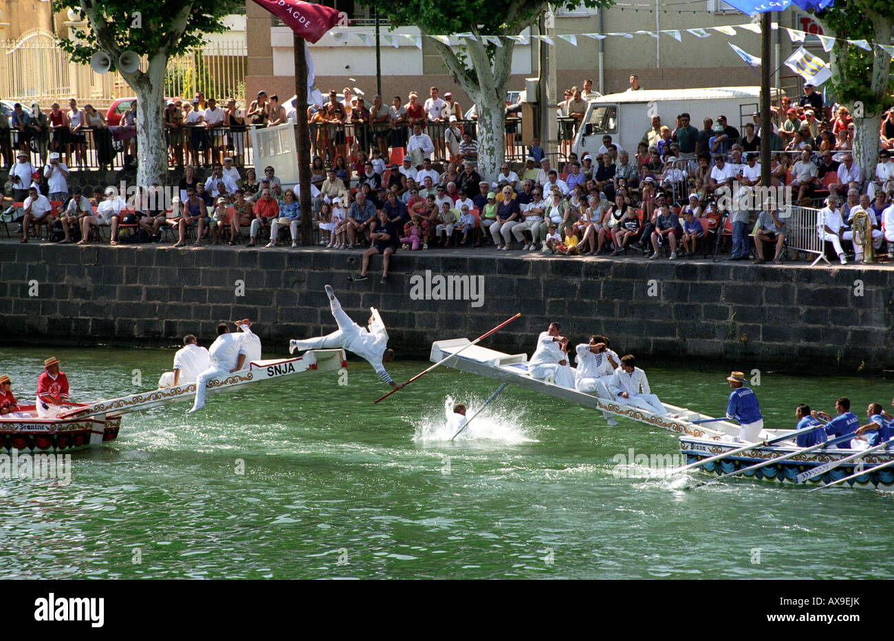 People falling, water Joust tournement Stock Photo - Alamy