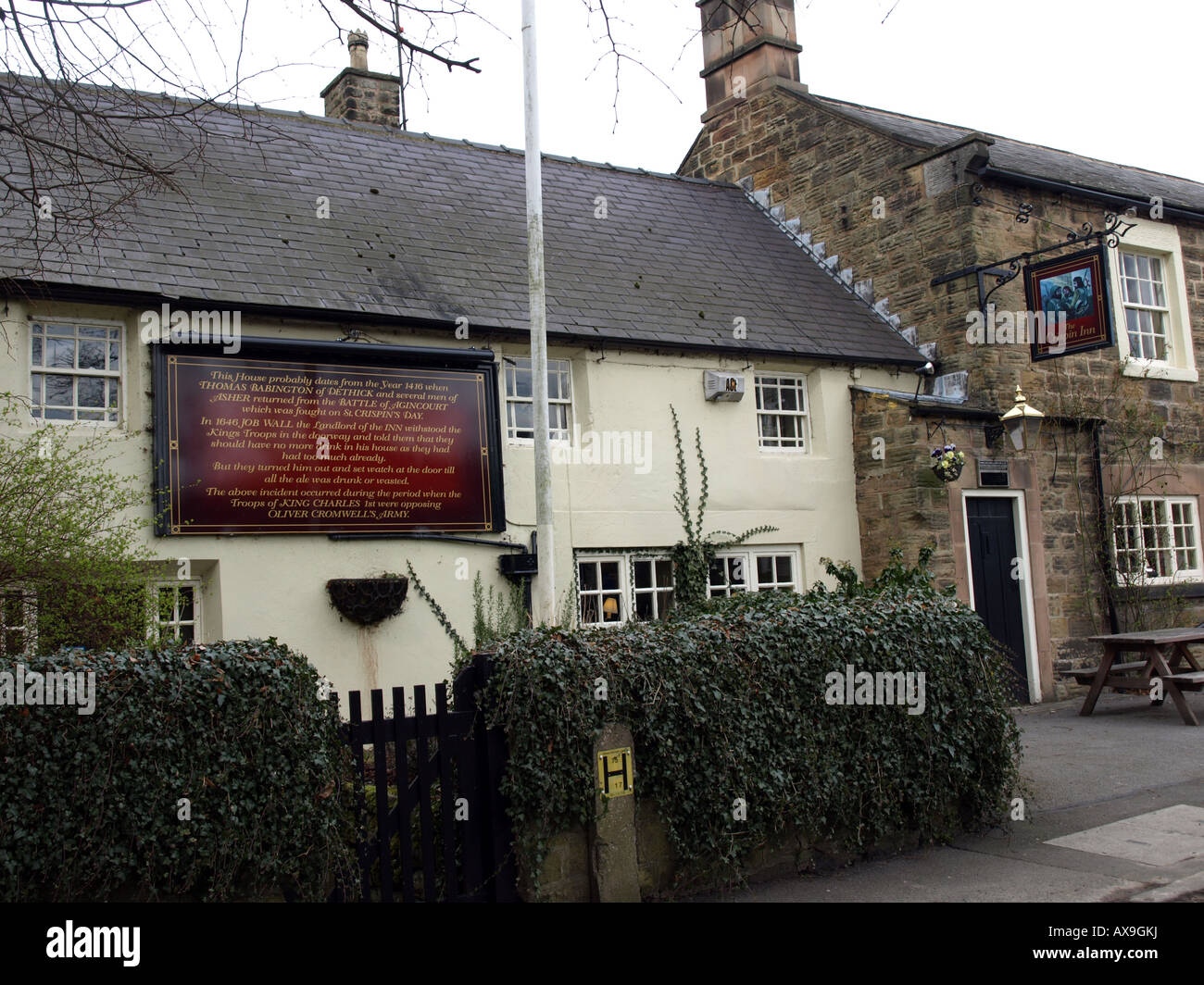 the crispin inn, ashover, derbyshire, with plaque explaining an ...