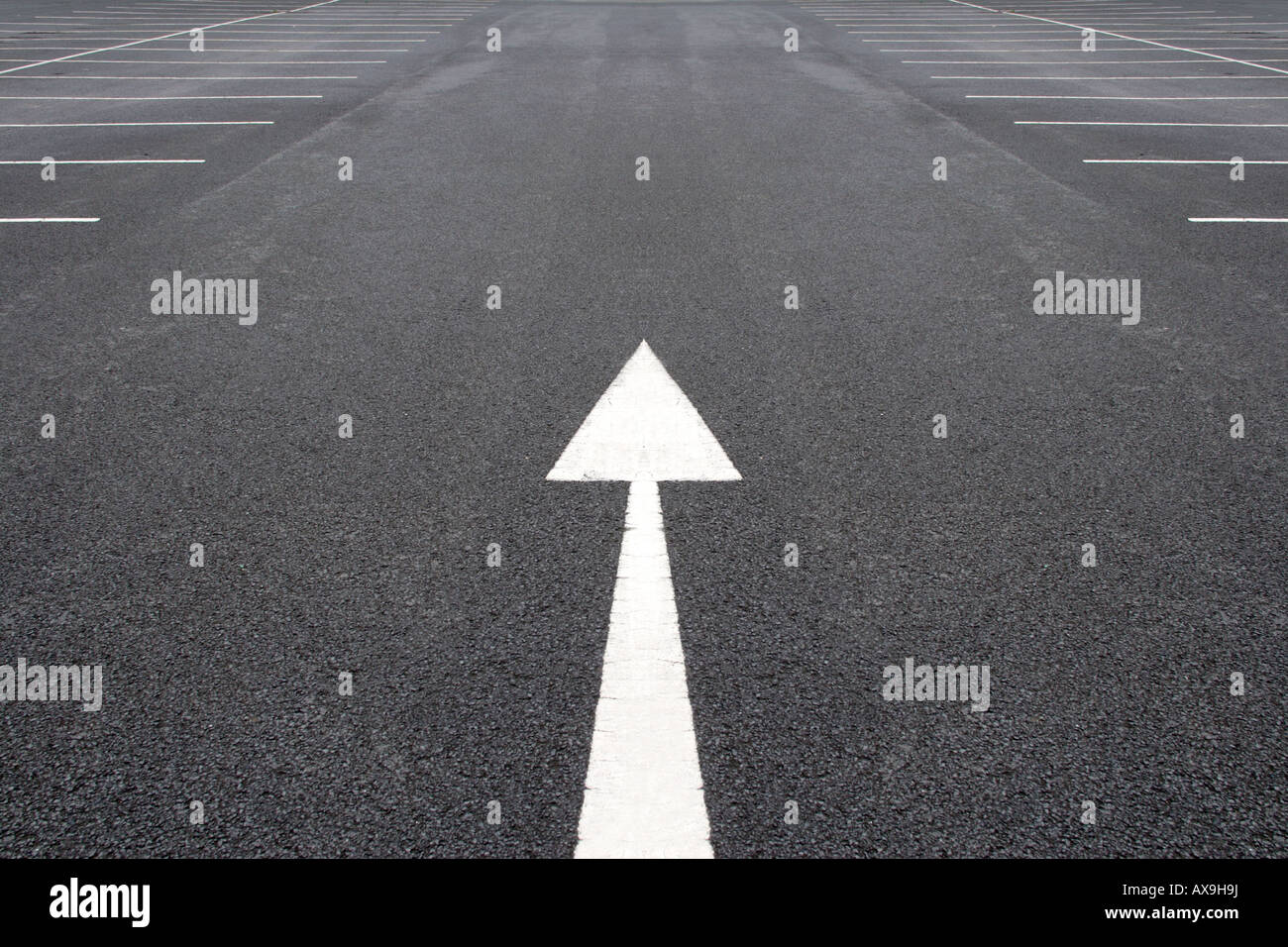 Forward arrow marking on road in carpark England UK Stock Photo - Alamy
