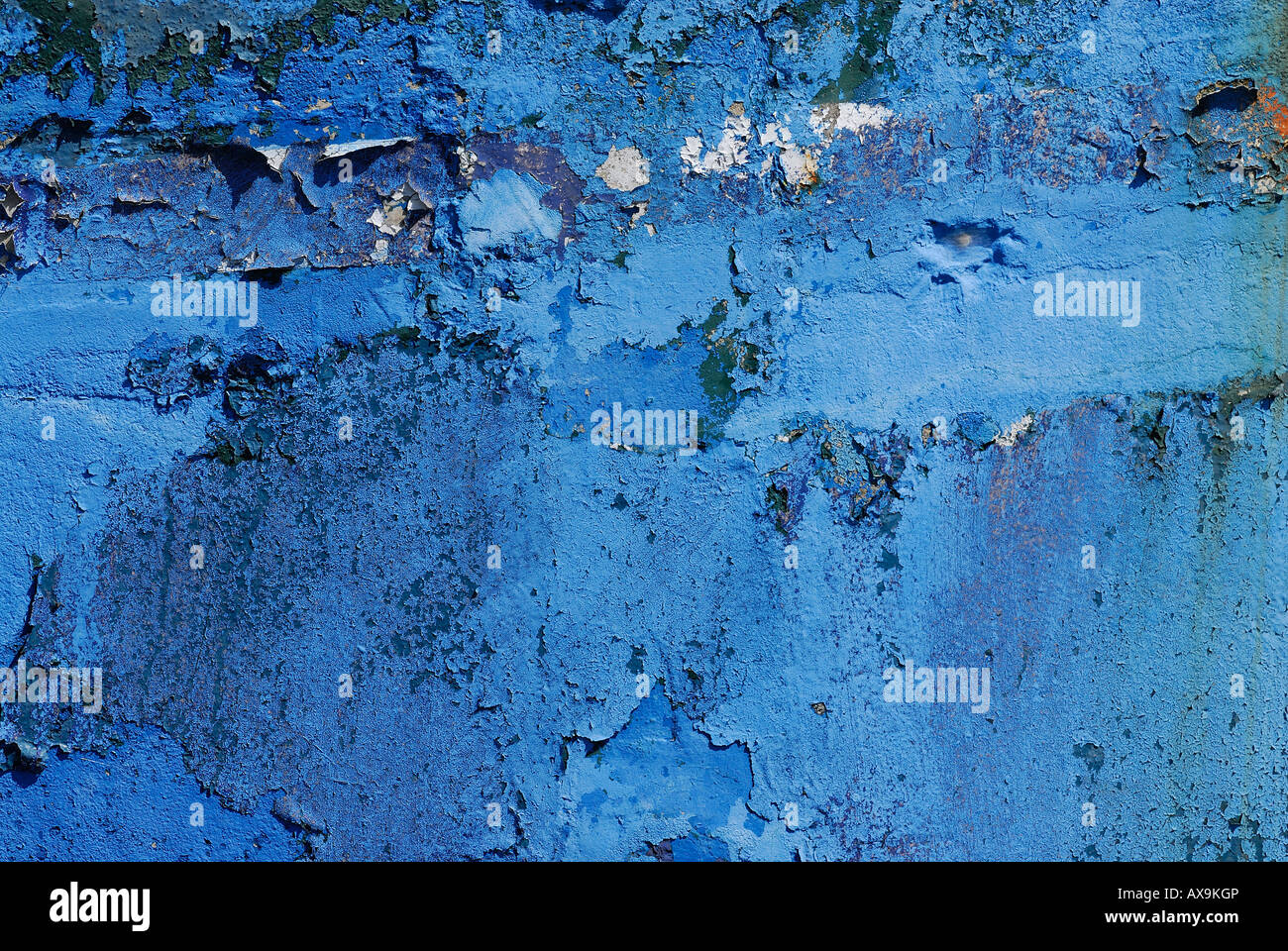 Peeling blue paint reveals layers of age and weathering, showcasing the ...