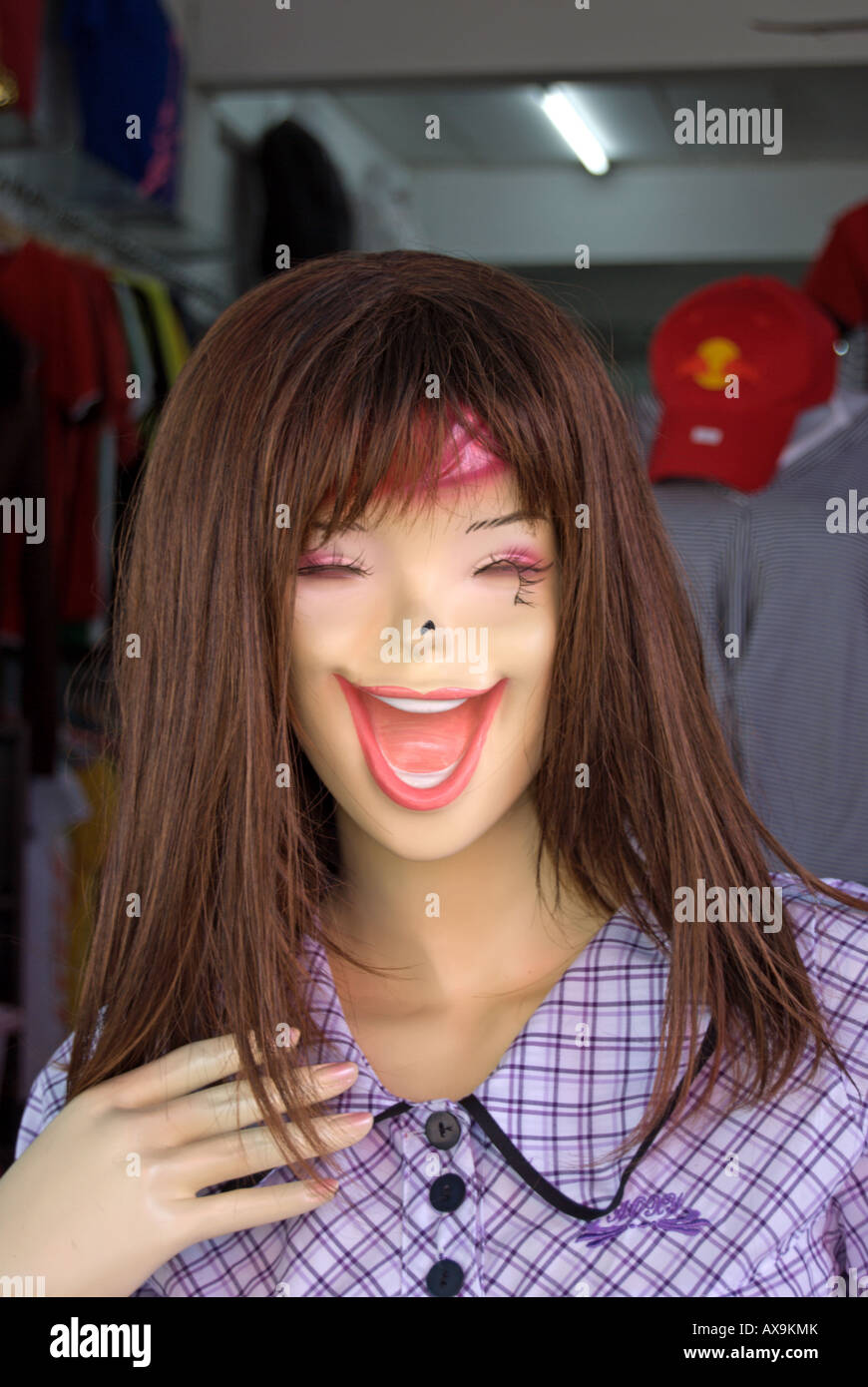 madly smiling shop dummy with wig, falling eyelashes and mark on nose ...