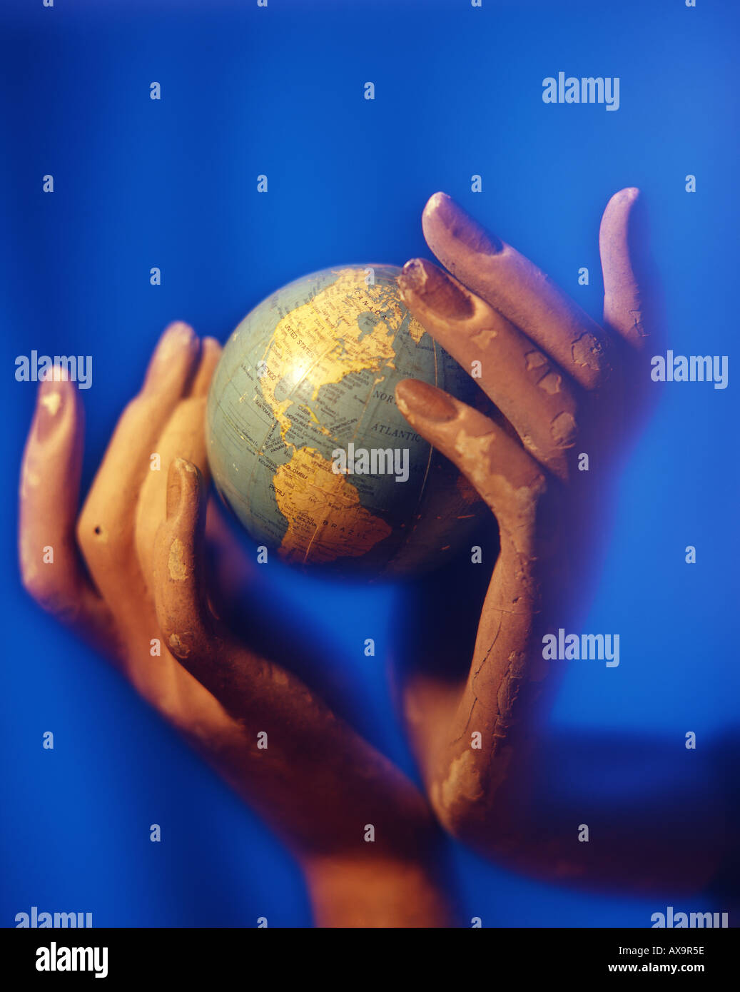 Hands around globe hi-res stock photography and images - Alamy
