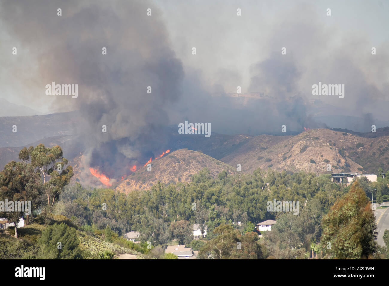 Brush fire in hills of Orange, California threaten homes Stock Photo ...