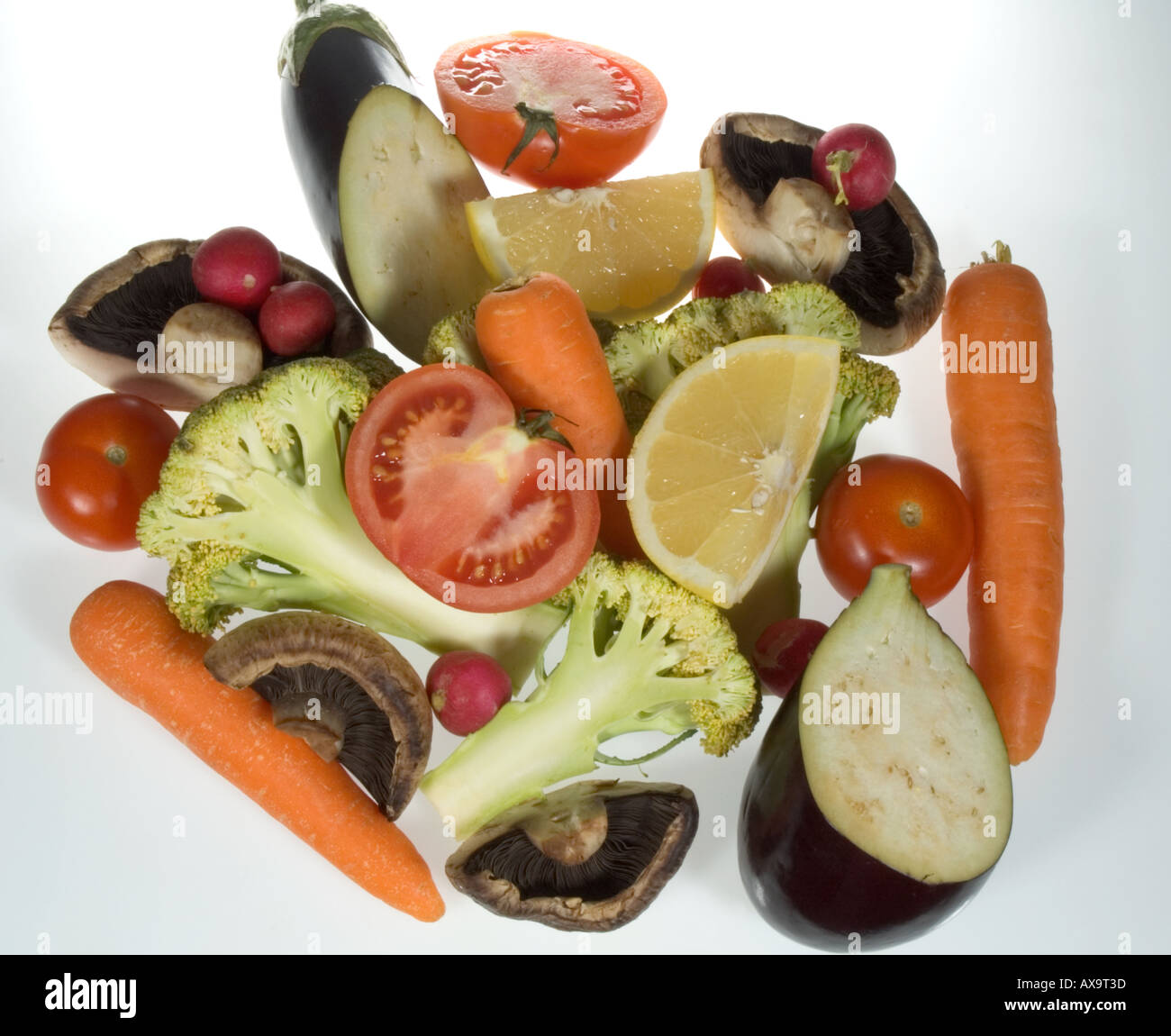 A selection of fruit and vegetables cut in half Stock Photo - Alamy