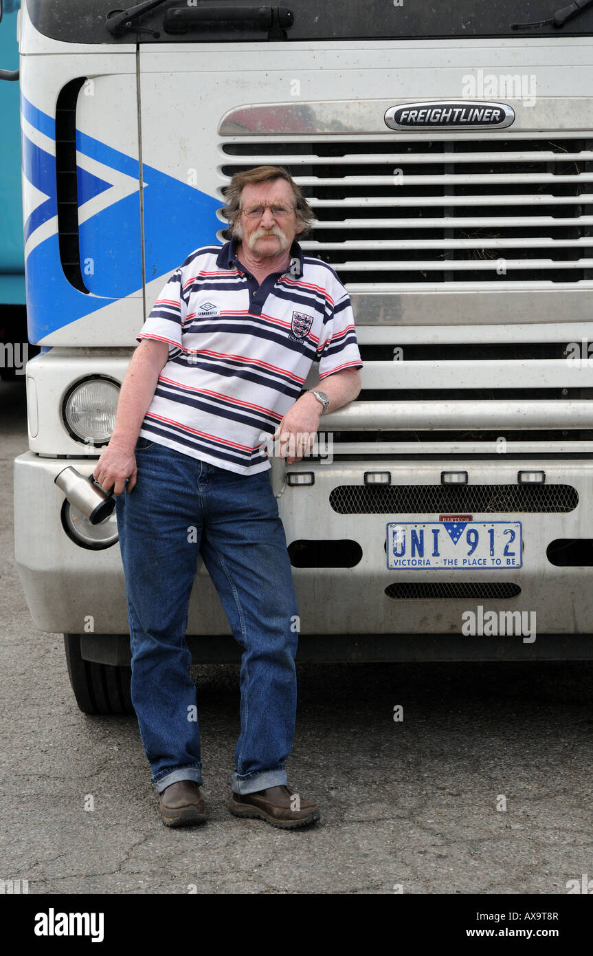 Portrait of 63 year old truck driver Dave Fry, standing next to his ...
