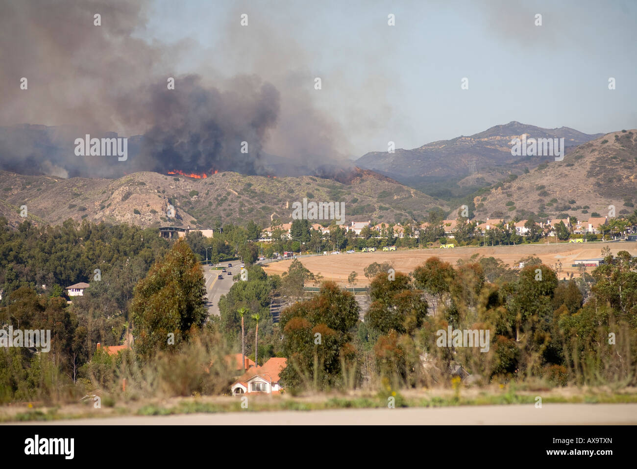 Brush fire in hills of Orange, California threaten homes Stock Photo ...