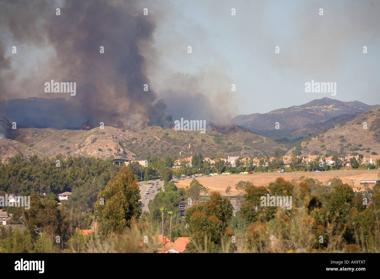 Brush fire in hills of Orange, California threaten homes Stock Photo ...
