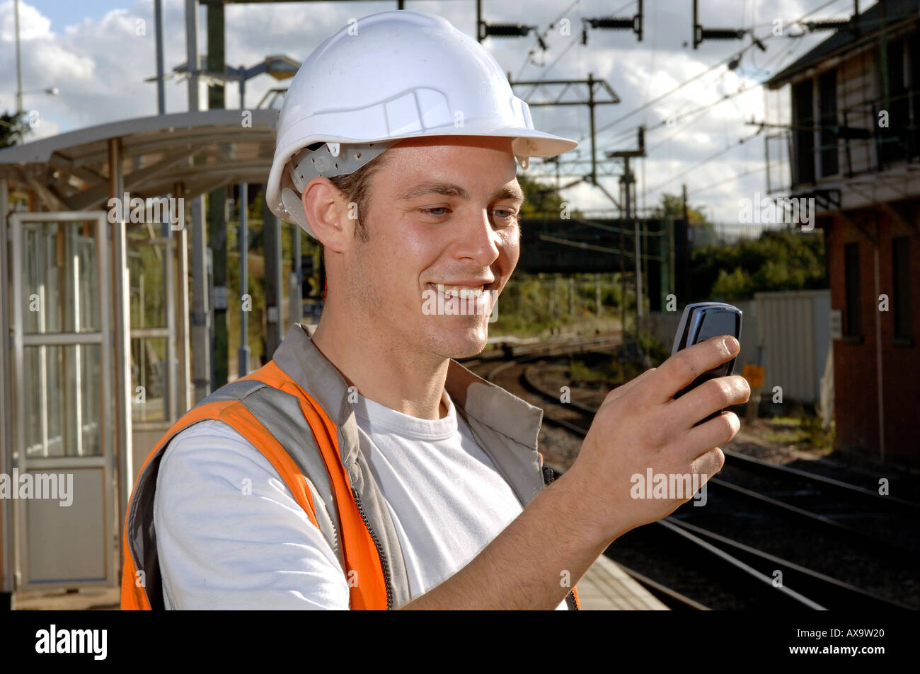 Rail Worker On The Phone Stock Photo - Alamy